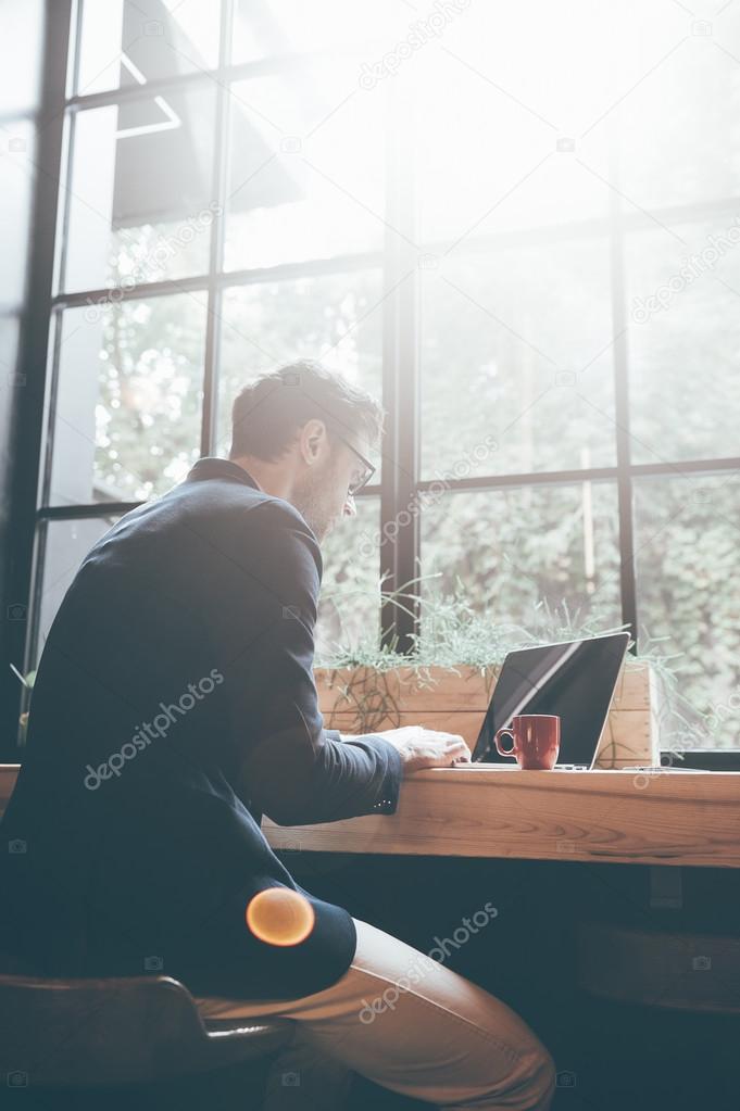 Handsome businessman at workplace table Stock Photo by ©gstockstudio ...