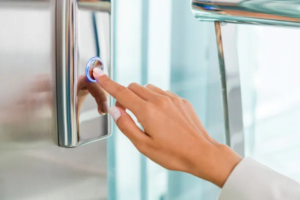 Hand pushing button of elevator - Stock Image - Everypixel