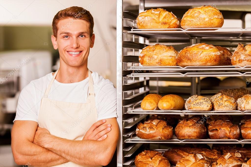 Baker with fresh bread Stock Photo by ©gstockstudio 54236017