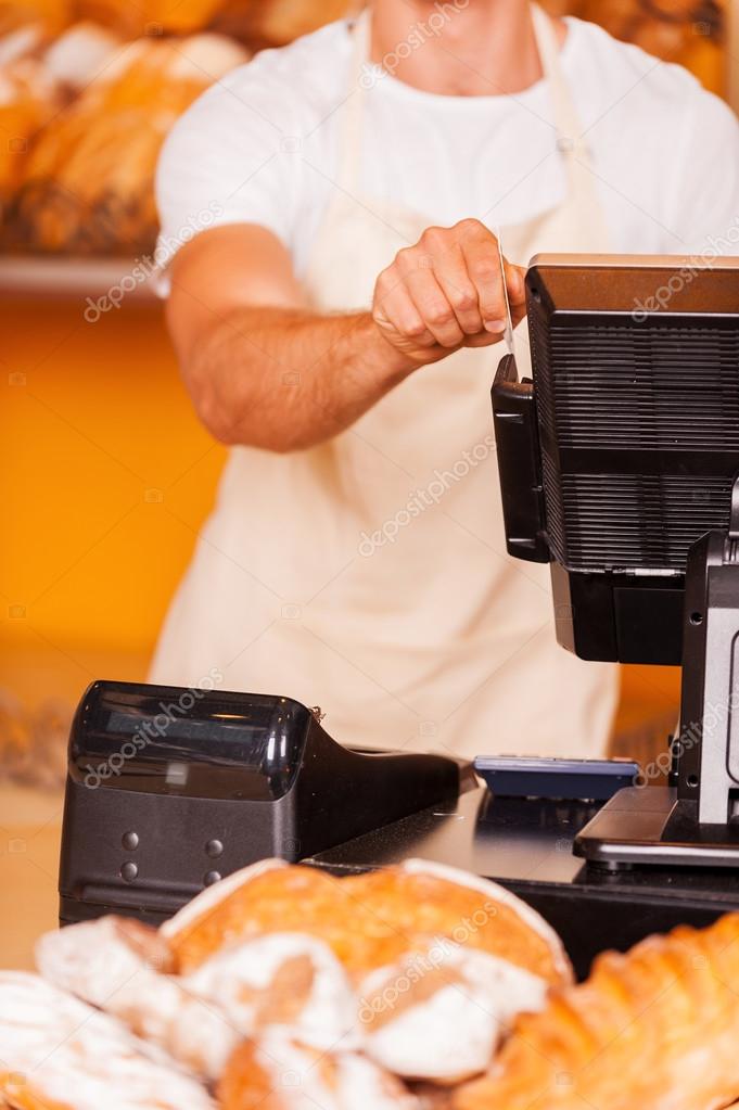 Cashier at work Stock Photo by ©gstockstudio 54236055