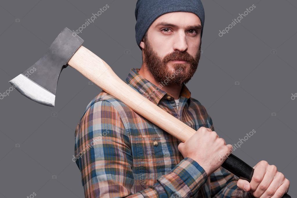 Bearded man holding a big axe Stock Photo by ©gstockstudio 54847935