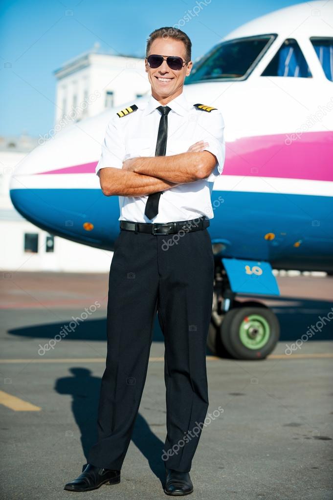 Confident male pilot in uniform — Stock Photo © gstockstudio #55975213