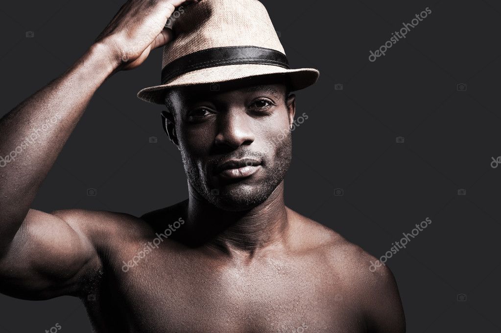 African man adjusting his hat Stock Photo by ©gstockstudio 57313187