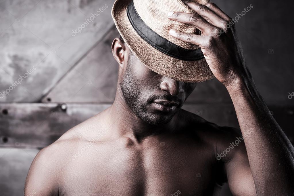 African man adjusting his hat ⬇ Stock Photo, Image by © gstockstudio ...