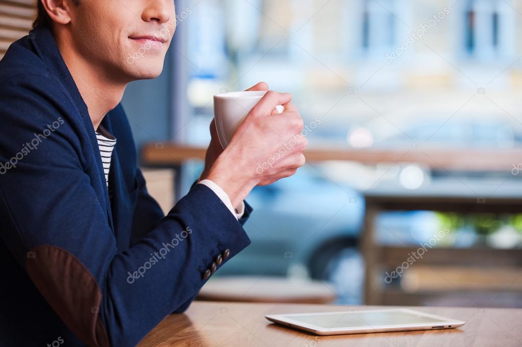 Man enjoying coffee in cafe Stock Photo by ©gstockstudio 57857191