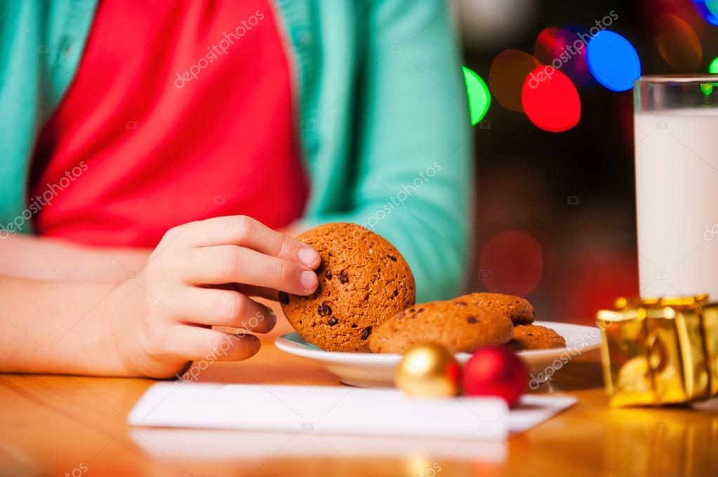 Little girl taking a cookie from plate Stock Photo by ©gstockstudio ...