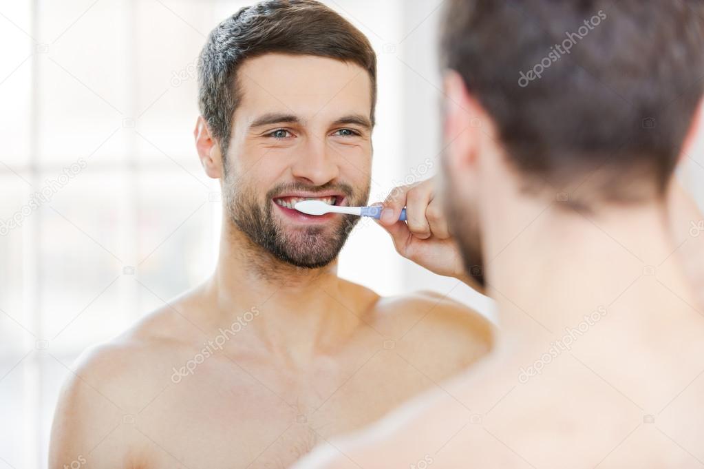 Man brushing his teeth Stock Photo by ©gstockstudio 62790293