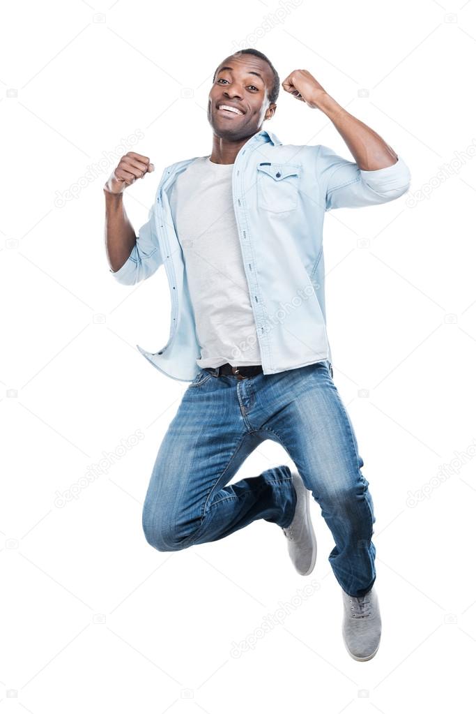 Young black man jumping Stock Photo by ©gstockstudio 65700303