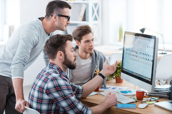 Business people looking at computer monitor - Stock Image - Everypixel