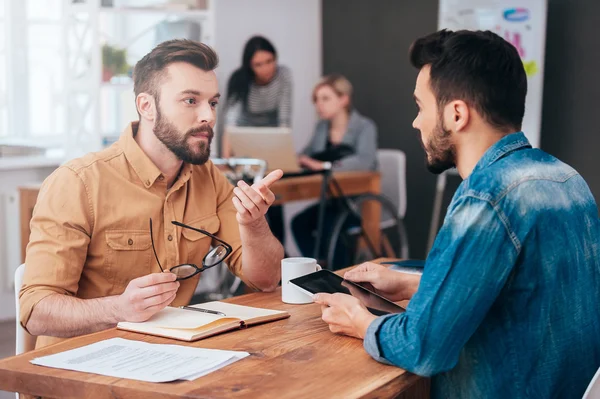 Men talking and gesturing in office - Stock Image - Everypixel