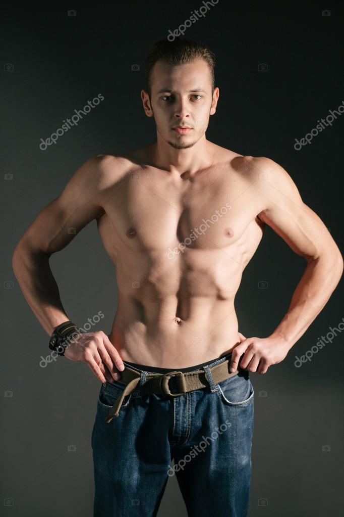 Muscular model pose Stock Photo by ©razyphoto 118663254