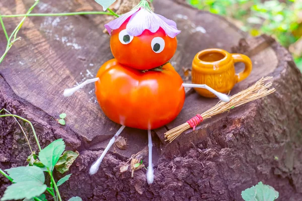 Funny figure from tomatoes in the garden. An example of decorative work ...