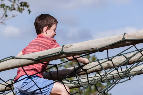 Child climbing fence Stock Photos, Royalty Free Child climbing fence ...