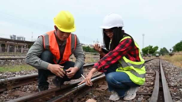 Two Engineers Working Train Station Consulting Development Guidelines ...