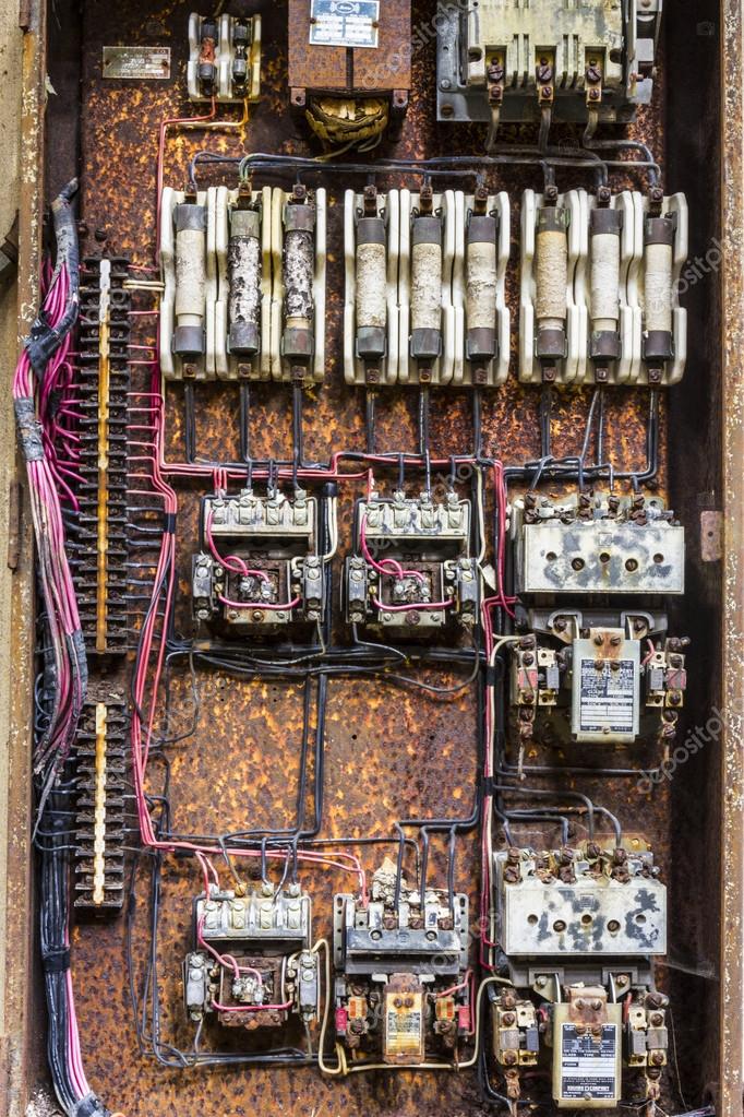 Old Rusted Electrical Panel with Fuses and Contacts in an Abandoned ...
