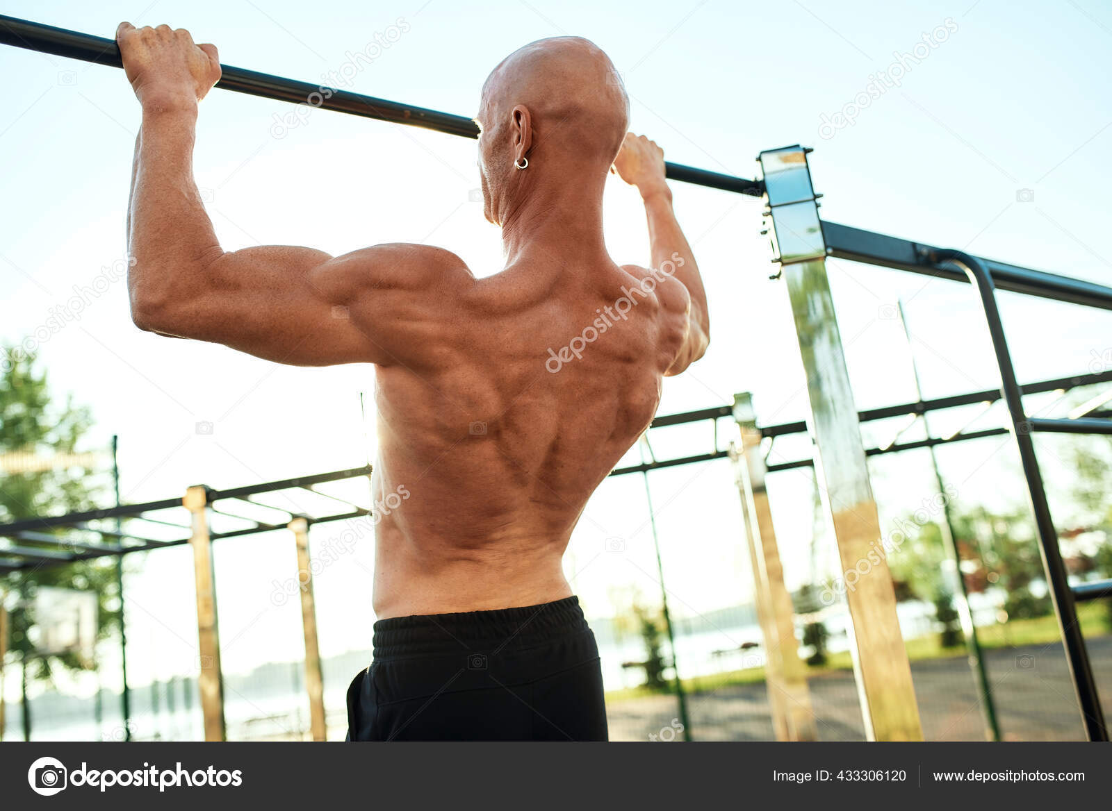 Sportsman pulling up wide grip hand on crossbar — Stock Photo ...