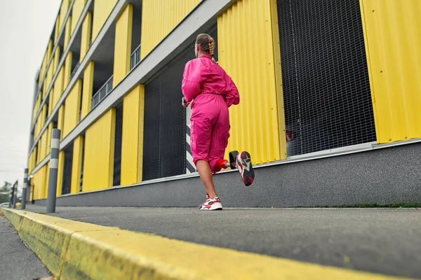 Disabled girl with artificial leg running in city Stock Photo by ...
