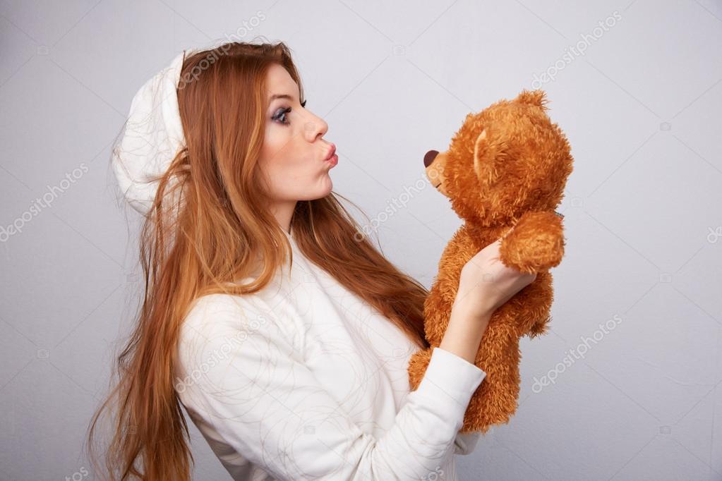 Red-haired woman with teddy bear — Stock Photo © nikolodion #108725288