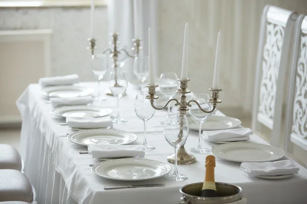 Decorated feast table in restaurant — Stock Photo © nikolodion #108745682