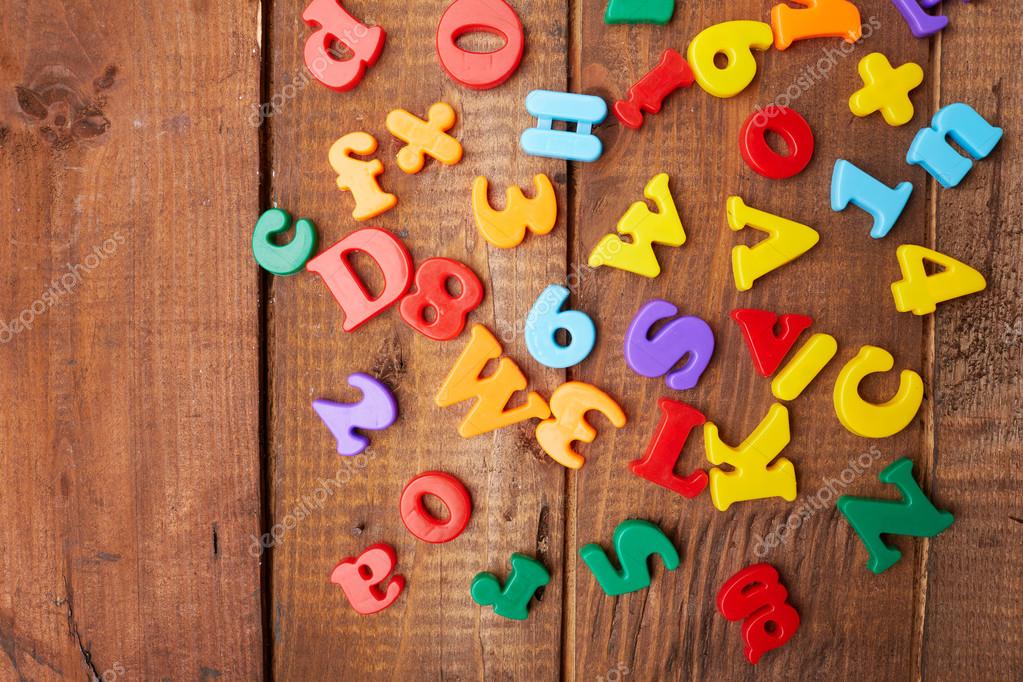 Colorful magnetic letters Stock Photo by ©nikolodion 112501212