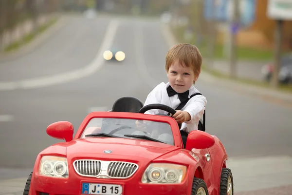 Little boy driving car — Stock Photo © nikolodion #85382724