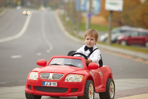 Little boy driving car — Stock Photo © nikolodion #85382578