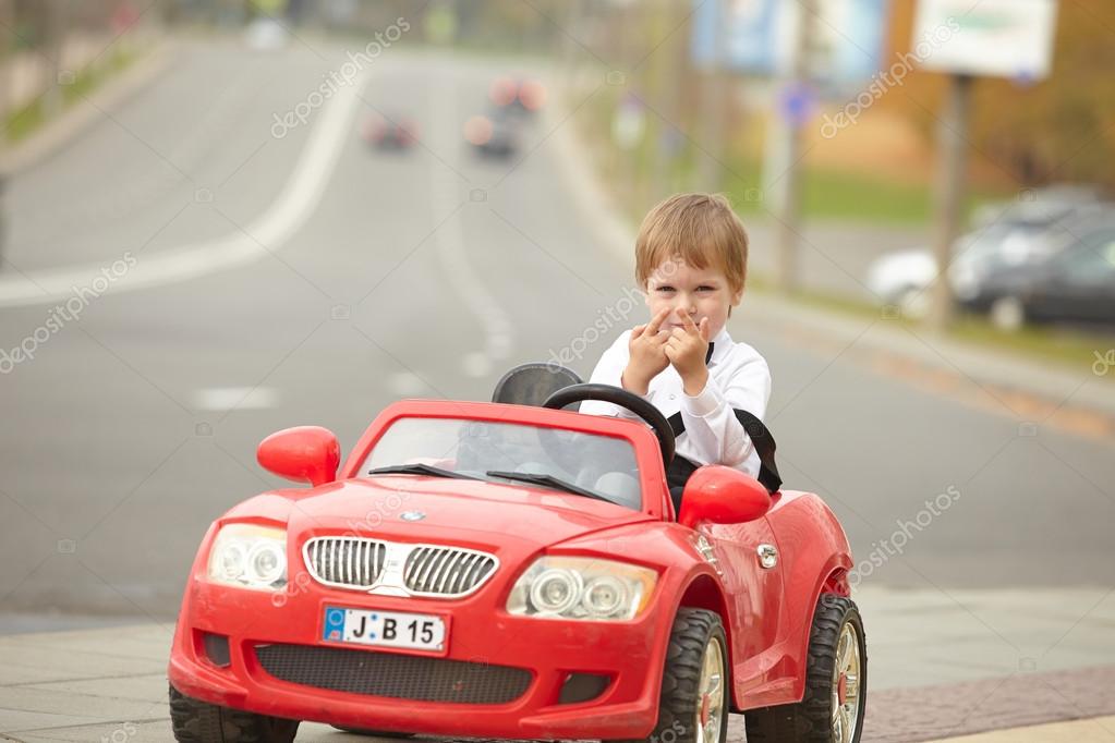 Little boy driving car — Stock Photo © nikolodion #85382724