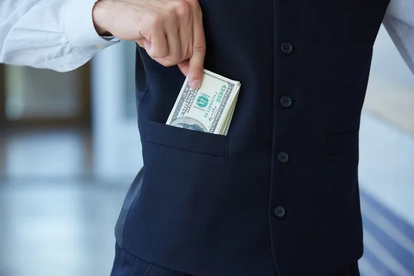 Sticking out of money from businessman pocket Stock Photo by ...