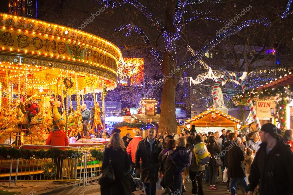 London, Leicester square traditional fun fair with stools, carrousel ...