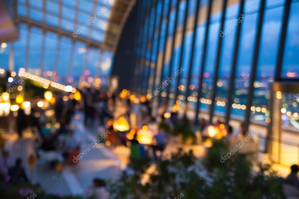 London's night life. People in restaurant, night lights blur — Stock ...