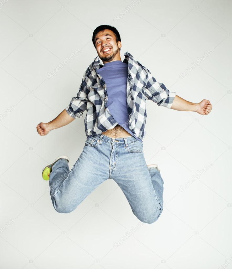 Young pretty asian man jumping Stock Photo by ©iordani 113008320