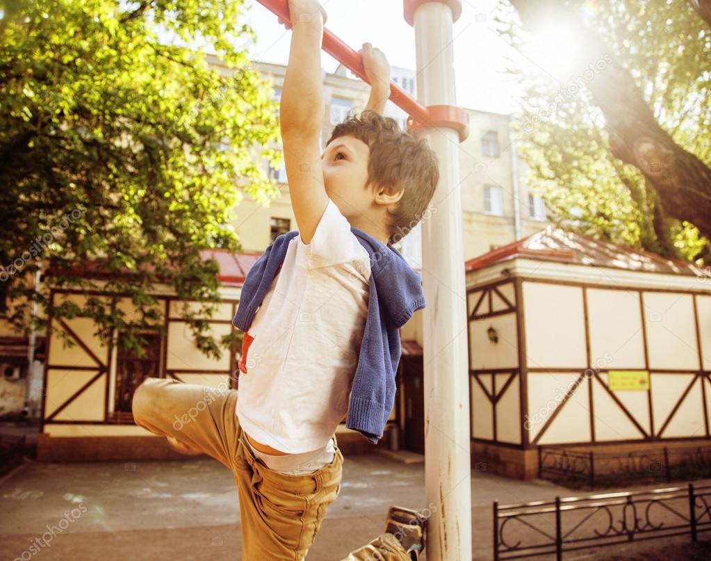 Little cute boy hanging Stock Photo by ©iordani 117622202