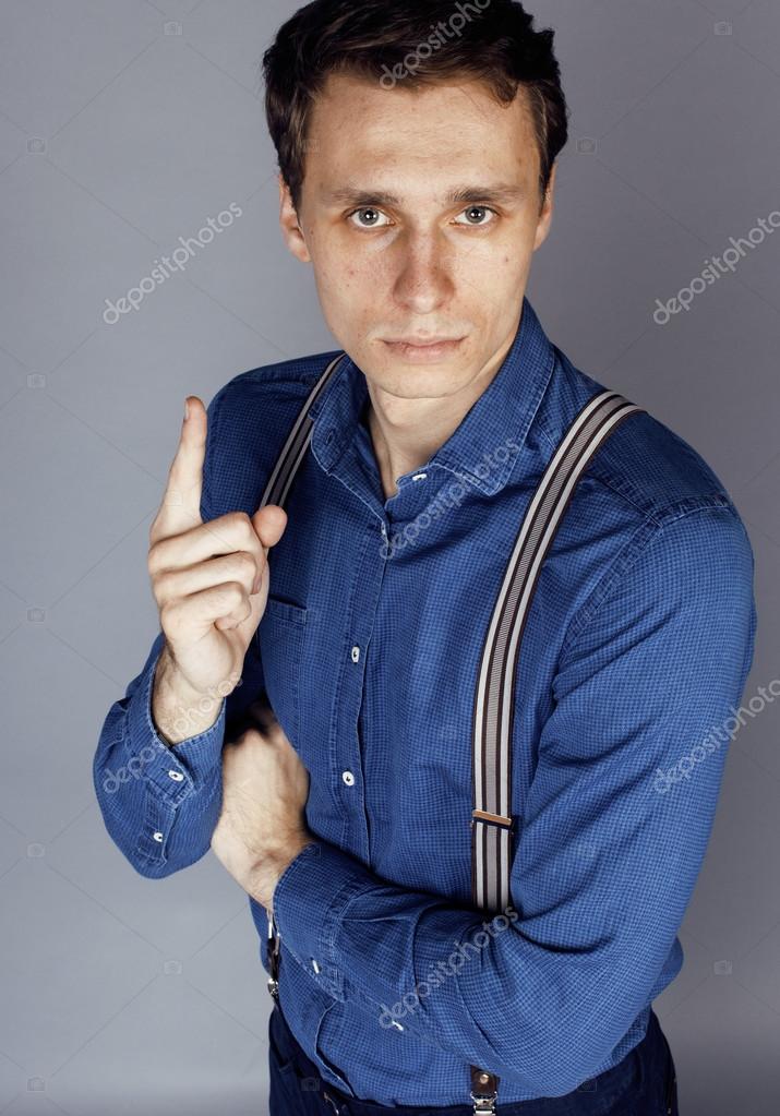 Young goofy man with pimples pointing in studio — Stock Photo © iordani ...