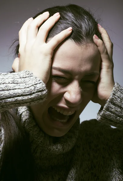 Young pretty woman in trouble, screaming in grief close up depressed ...