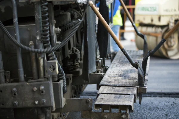 Tracked paver at asphalt pavement works for road repairing - Stock ...