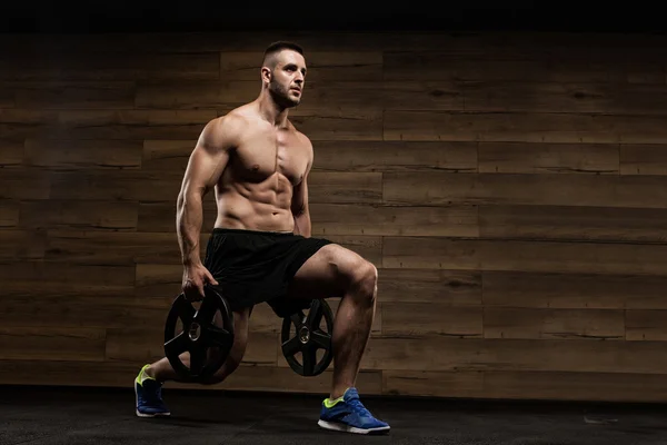 Handsome man with big muscles, posing at the camera in the gym Stock ...