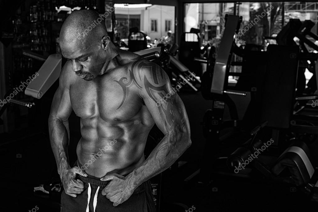 Athlete muscular brutal bodybuilder emotional posing in the gym Stock ...