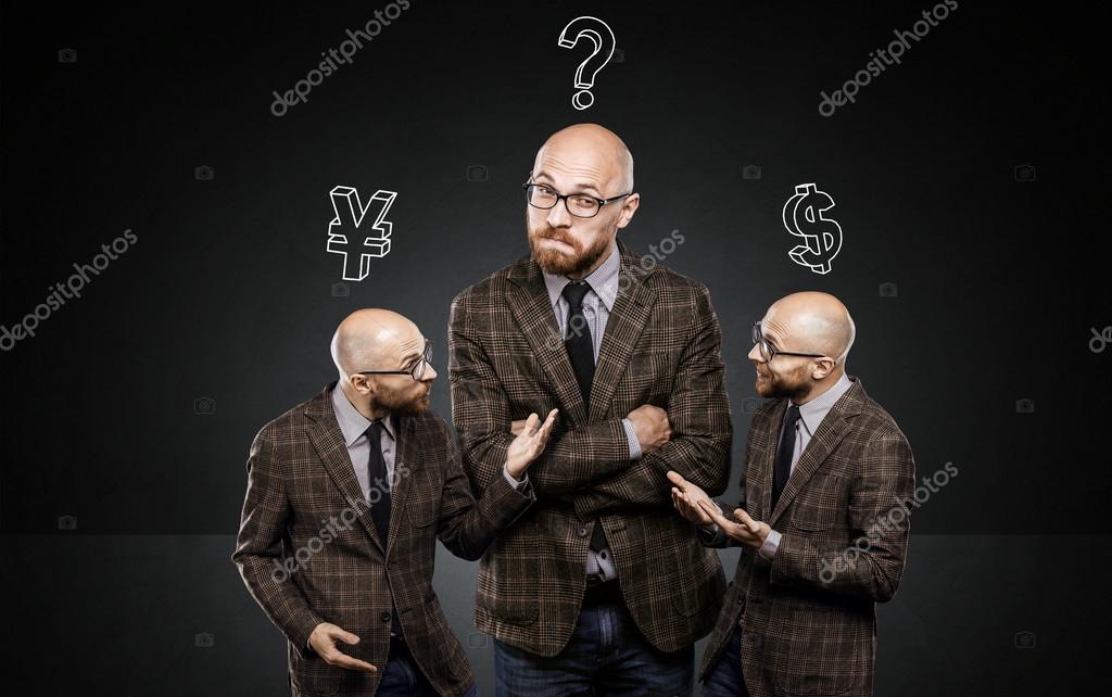 Three identical men argue among themselves about important issues Stock ...
