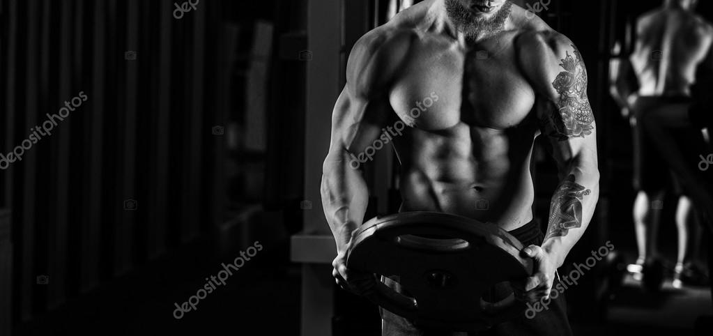 Powerlifter with strong arms lifting weights Stock Photo by ©roman.l ...