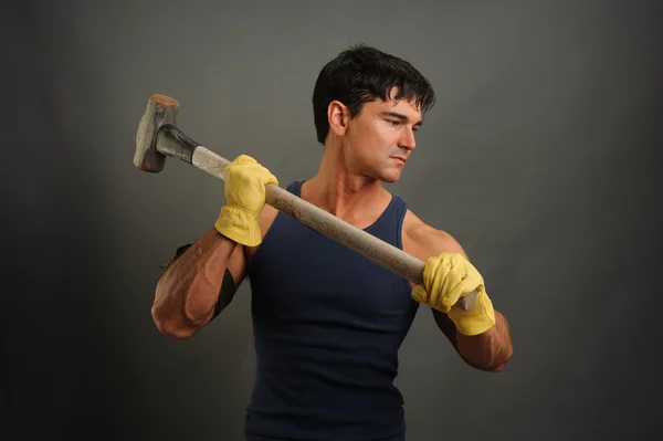 Strong fat man holding a big hammer Stock Photo by ©profoto8213 42748837