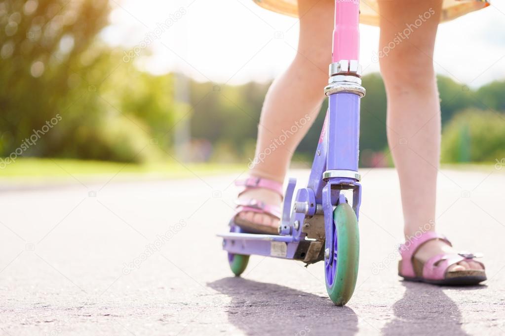 Closeup view with legs on scooter Stock Photo by ©2s 114968738