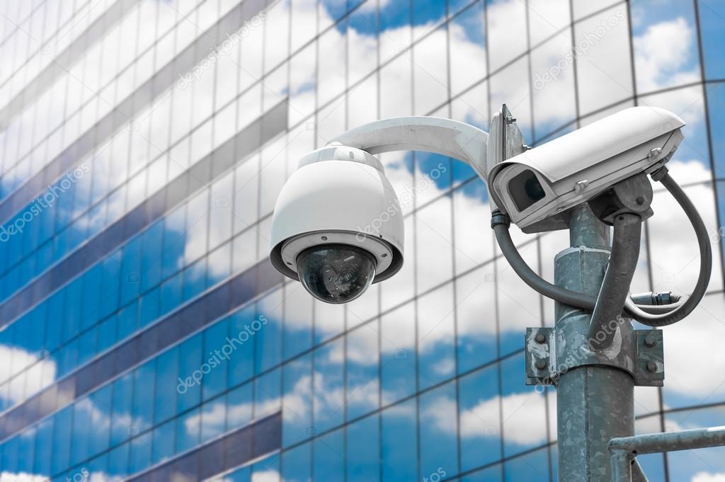 CCTV camera or surveillance operating with galss building in bac Stock ... CCTV camera or surveillance operating with galss building in bac Stock ...