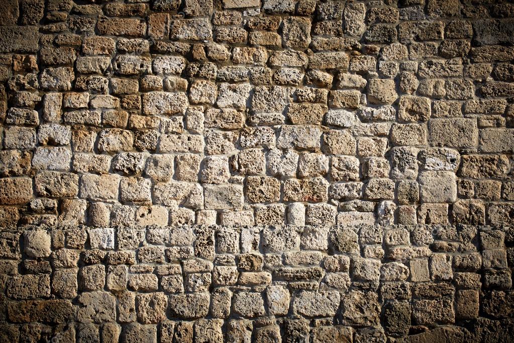 Ancient stone wall of the amphitheater as background — Stock Photo ...