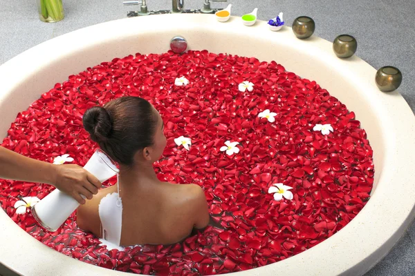 Body care female in bath with rose petal - Stock Image - Everypixel