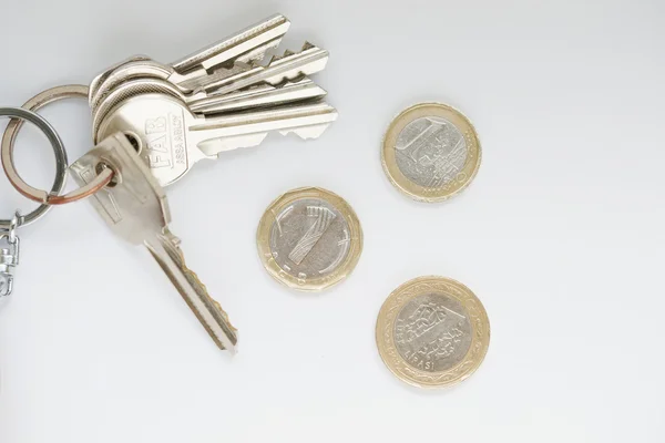 Keys and coins — Stock Photo © oliveshadow #86230330