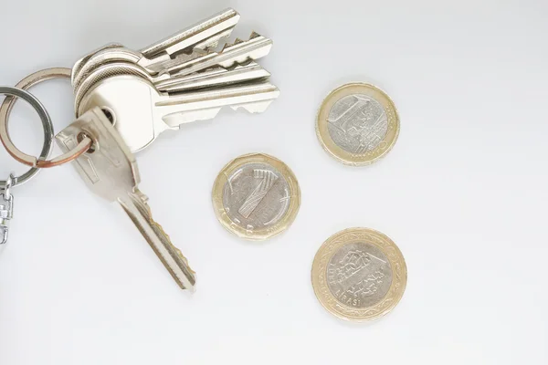 Keys and coins — Stock Photo © oliveshadow #86230330