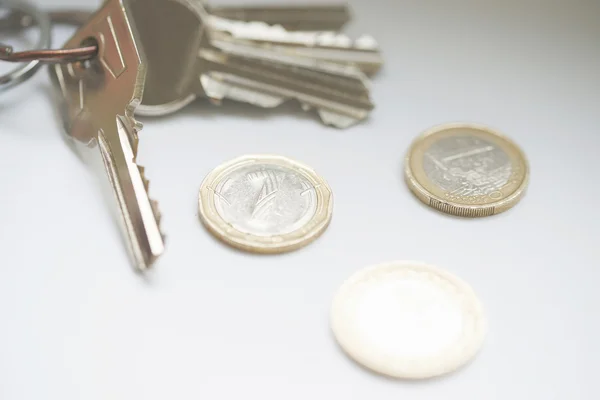 Keys and coins — Stock Photo © oliveshadow #86230330