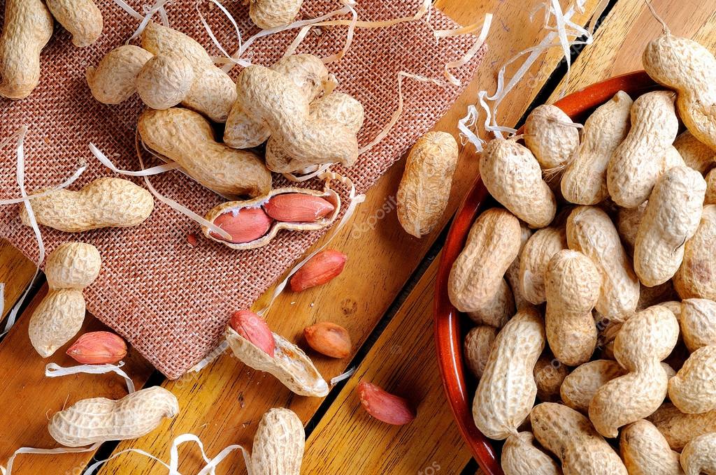 Group of peanuts on a table in the field top view Stock Photo by ...
