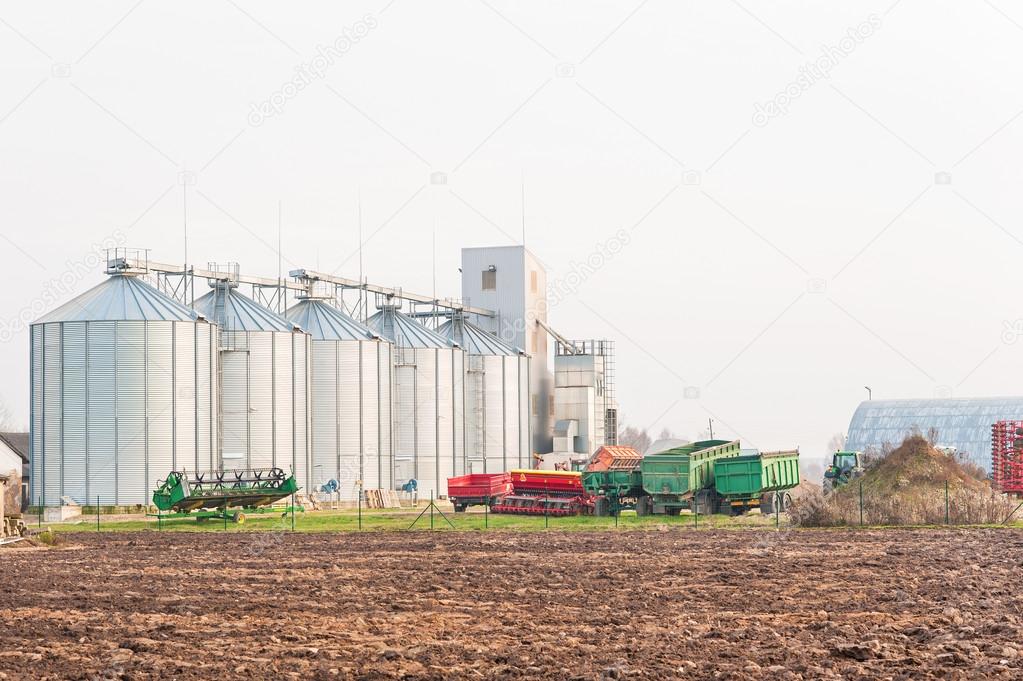 Farm grain storage bins. Outdoors. Stock Photo by ©krasnajasapocka 64689975