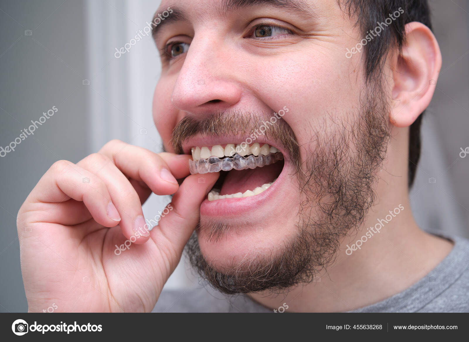 Close Young Latin Man Adjusting Orthodontic Silicone Trainer Invisible ...